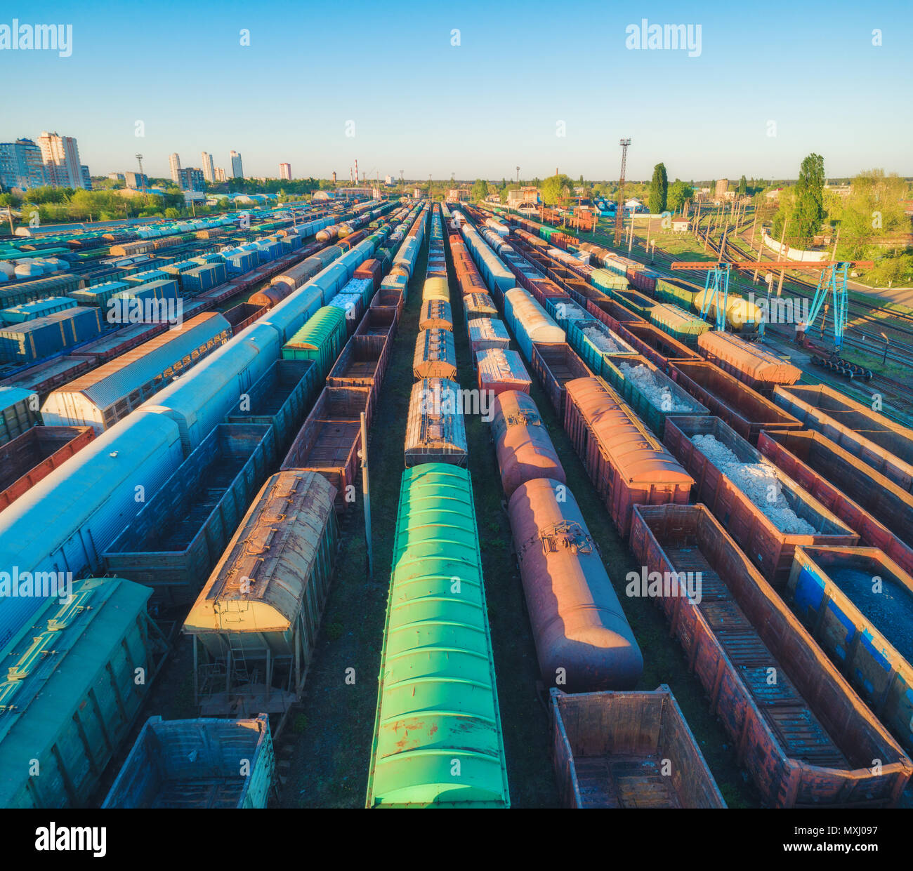 Aerial view of colorful freight trains. Cargo wagons on railway station ...