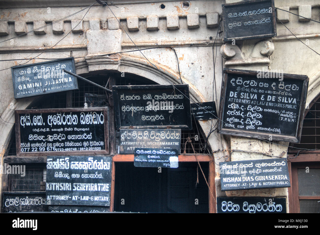 KANDY, SRI LANKA - DECEMBER 2017: Historic walls with lots of signs for ...