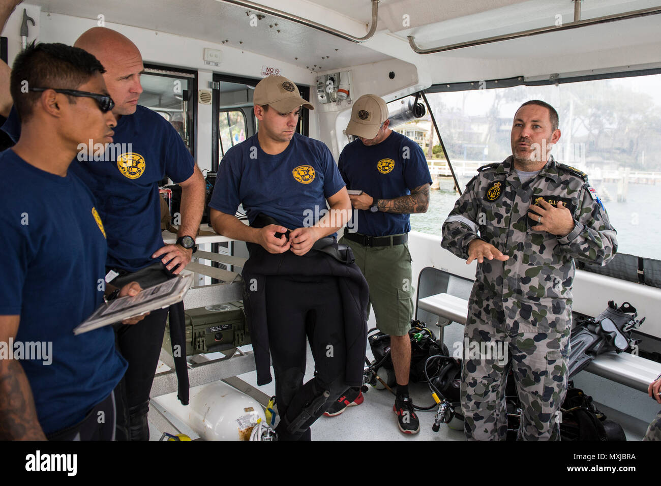 Navy Divers assigned to Mobile Diving Salvage Unit (MDSU) 1 and a Royal ...