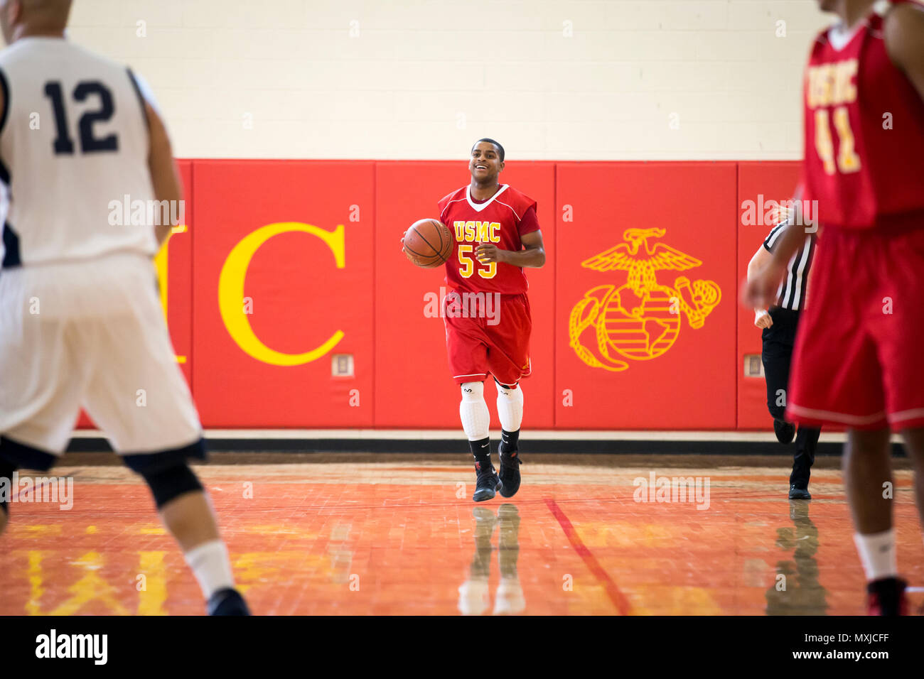 U.S. Marine Corps Cpl. Bryan Baptiste of the All Marine basketball team ...