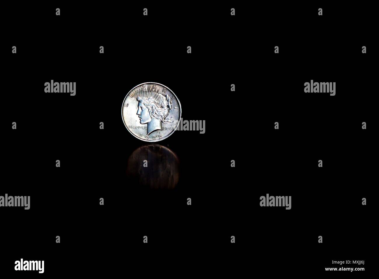 Silver coin with head symbol Stock Photo - Alamy