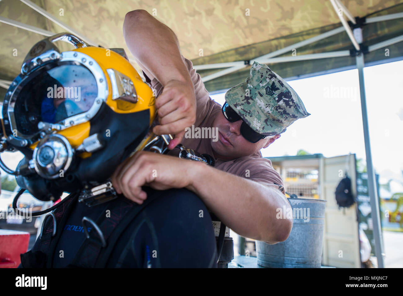 Petty Officer 1st Class Matt Ramirez, right, assigned to Underwater ...