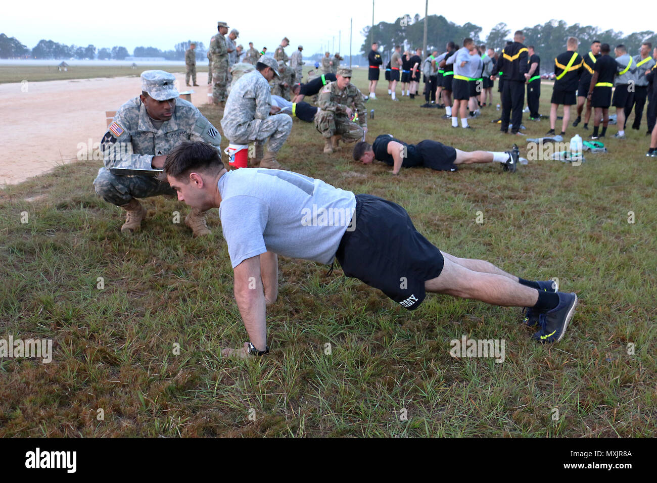 3rd Infantry Division Soldiers do pushups for an Army Physical Fitness ...