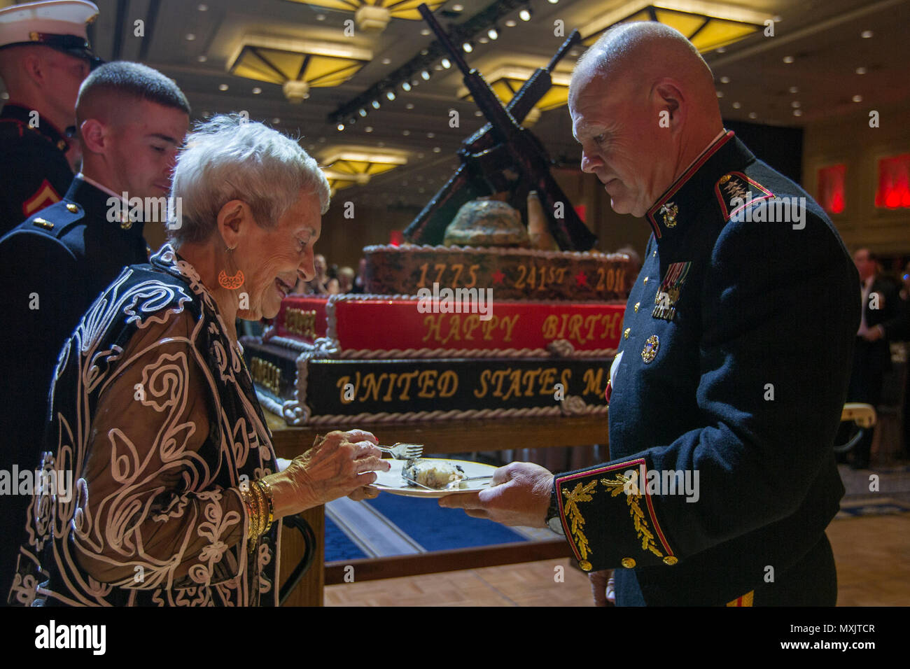 Commandant of the Marine Corps (CMC) Gen. Robert B. Neller presents a ...