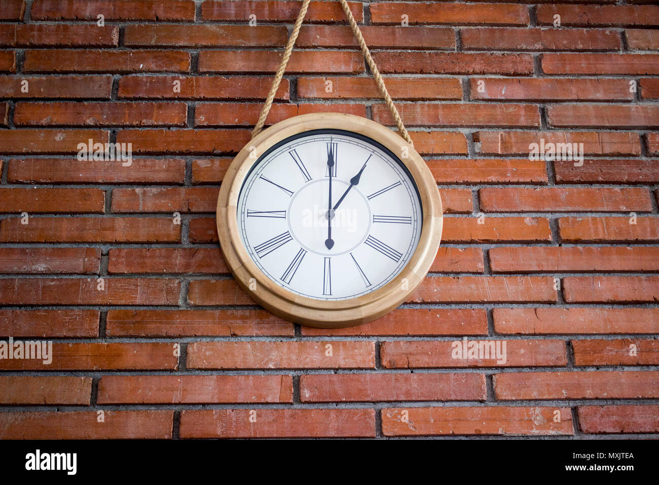 Old fashioned wall clock with roman numerals hi-res stock photography ...
