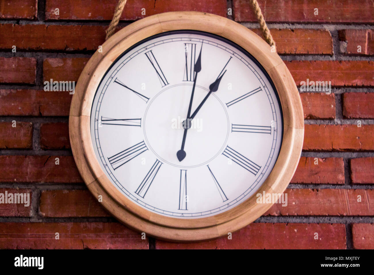 Brick wall with clock hi-res stock photography and images - Alamy