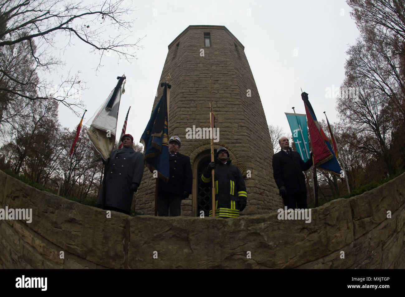 German soldiers and citizens hold up flags during a German National Day ...
