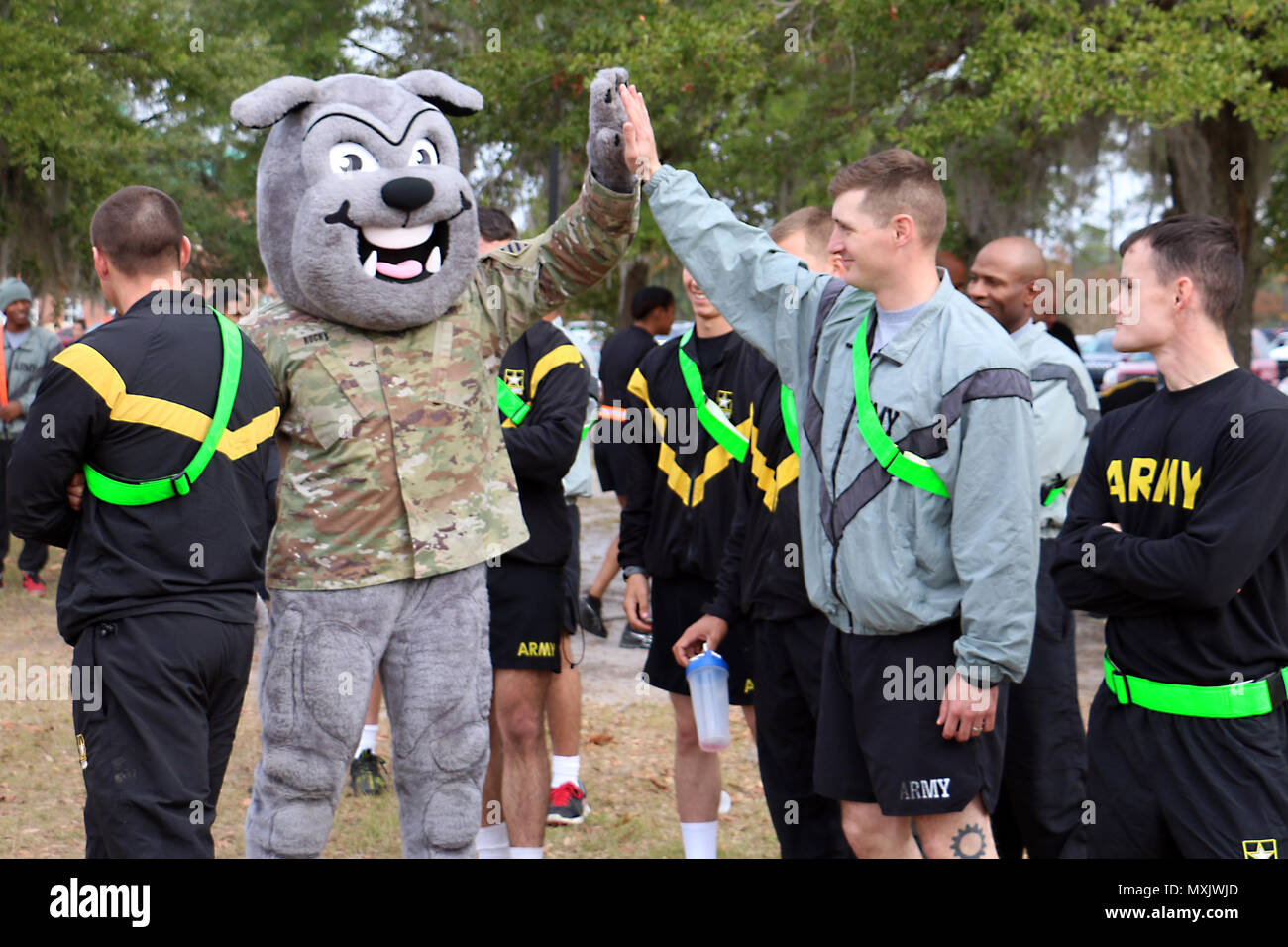 Sgt. Rocky (left), mascot of 3rd Infantry Division, high-fives a ...