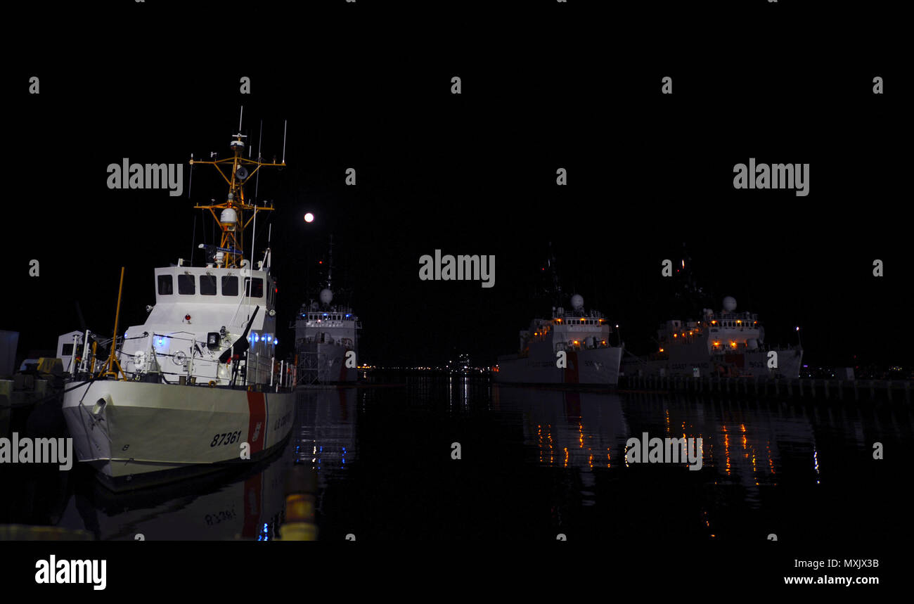The supermoon shines over Coast Guard Cutters Sea Horse, Legare ...