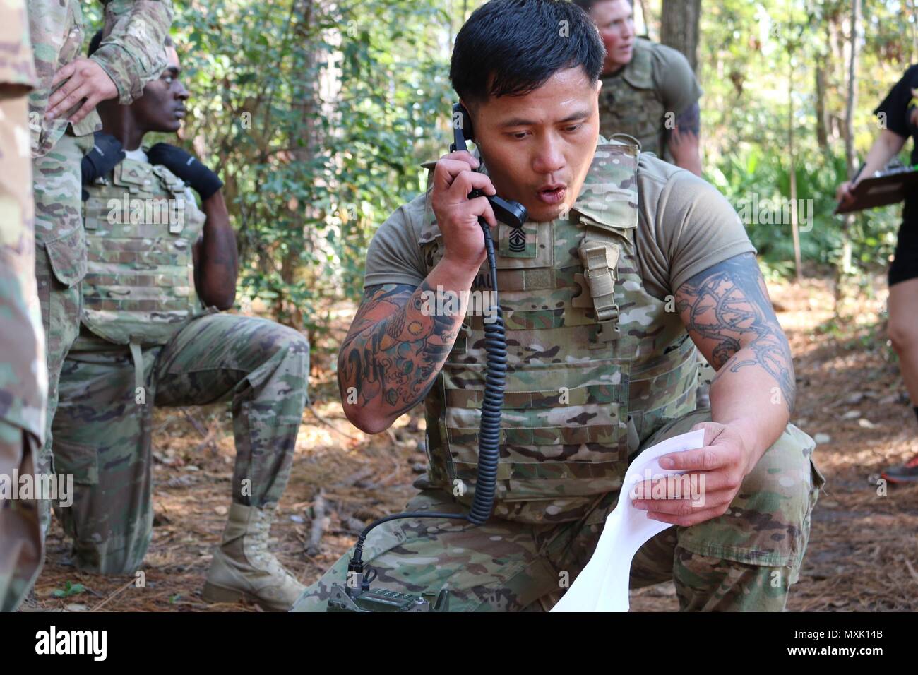 A Soldier calls in a report at the Marne Mile Obstacle Course at Fort ...