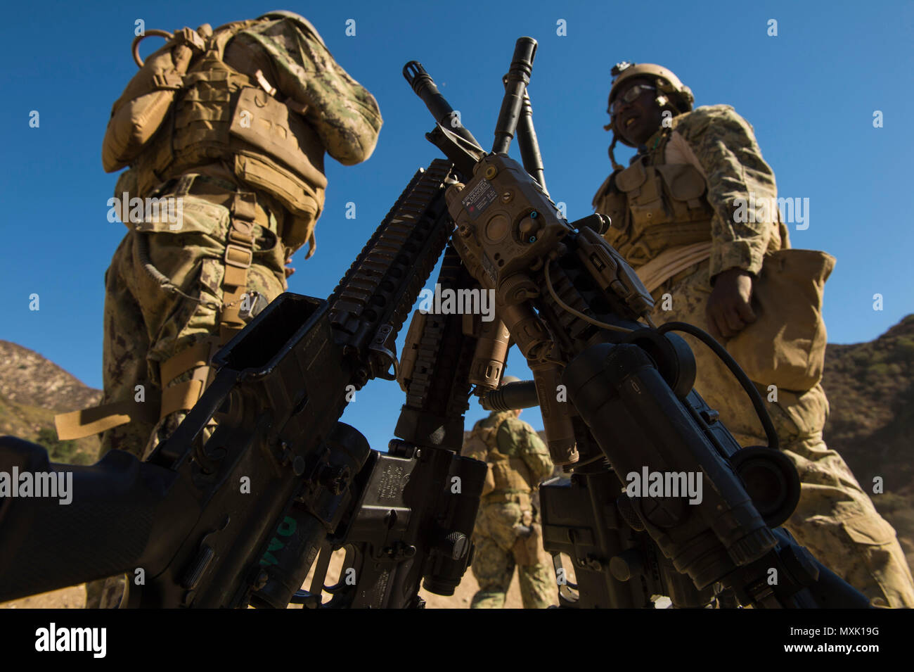 Petty Officer 1st Class Ledget Glover III, left, and Petty Officer 1st ...