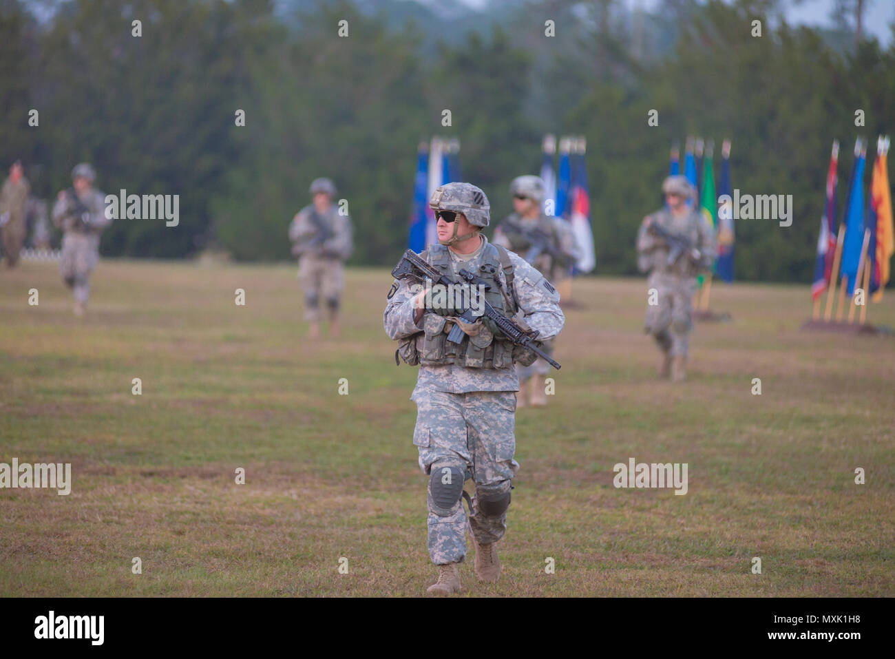 A 3rd Infantry Division infantry squad participates in Twilight Tattoo ...