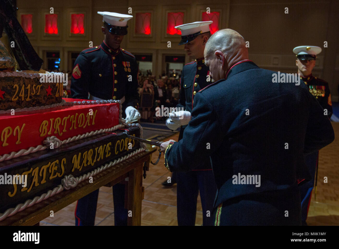 Commandant of the Marine Corps (CMC) Gen. Robert B. Neller cuts a cake ...