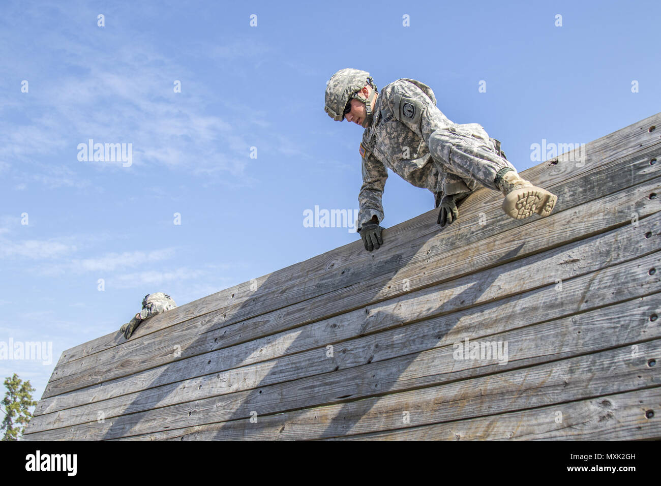 A Soldier from 3rd Infantry Division climbs over the wall during the ...