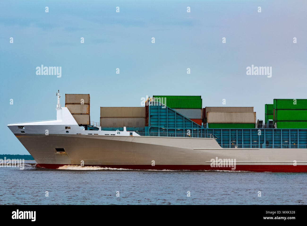 Grey container ship. Logistics and production import Stock Photo - Alamy