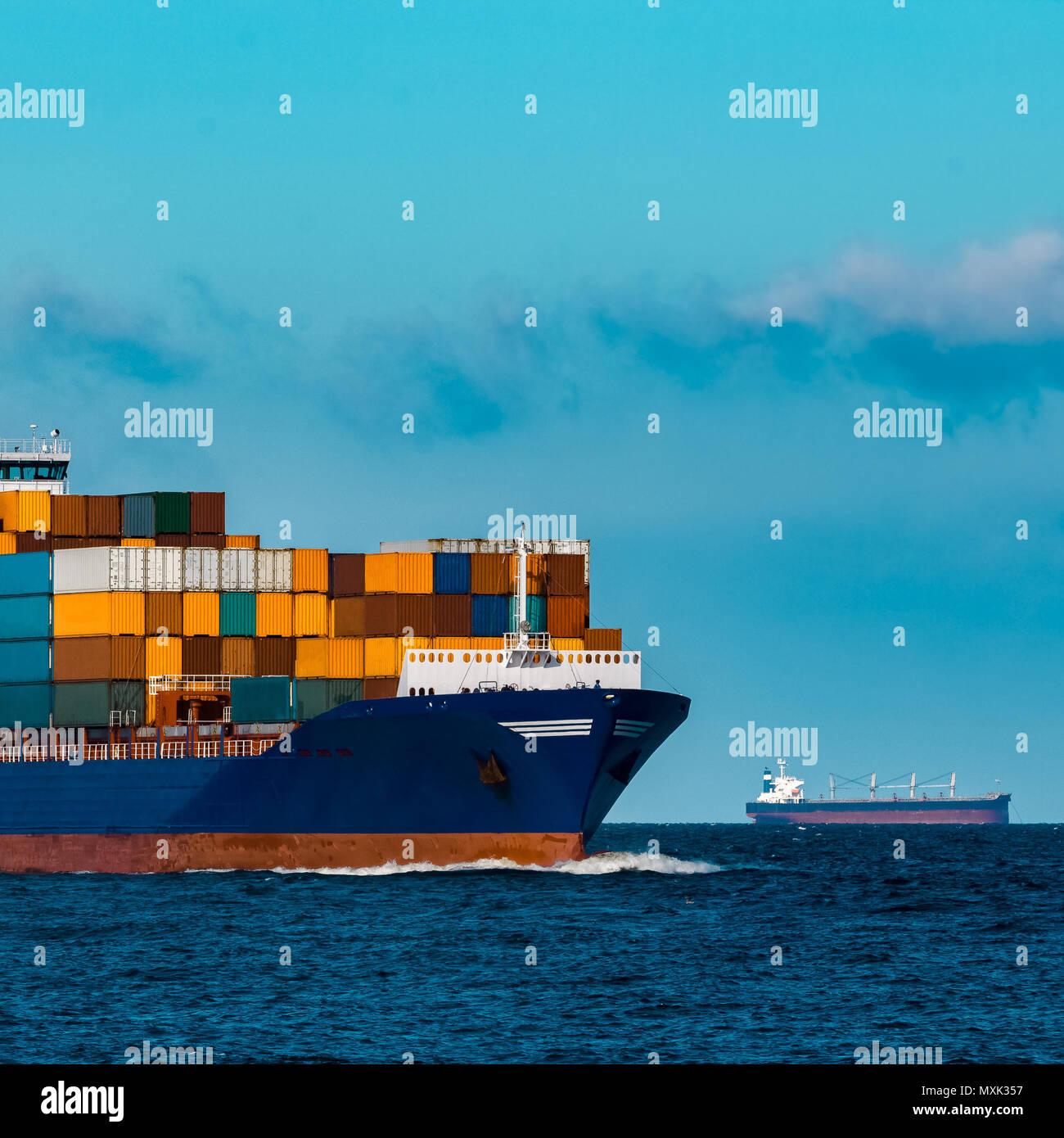 Blue container ship in travel. Logistics and freight industry Stock ...