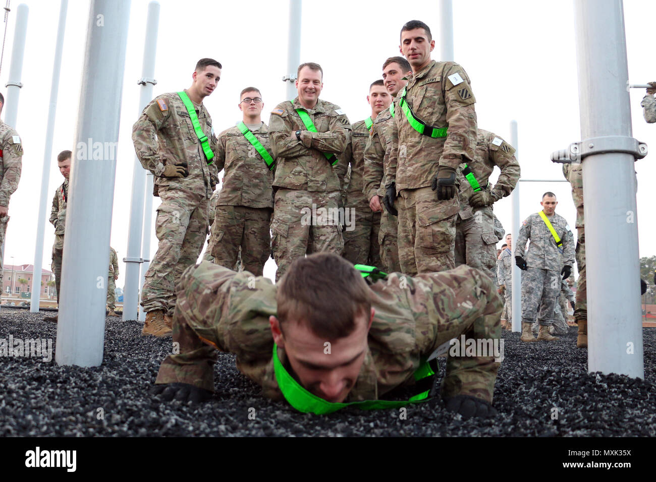 3rd Infantry Division Soldiers motivate their teammate as he does ...