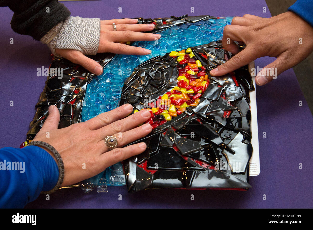 Guests touch artwork created for touching its texture by Air Force ...