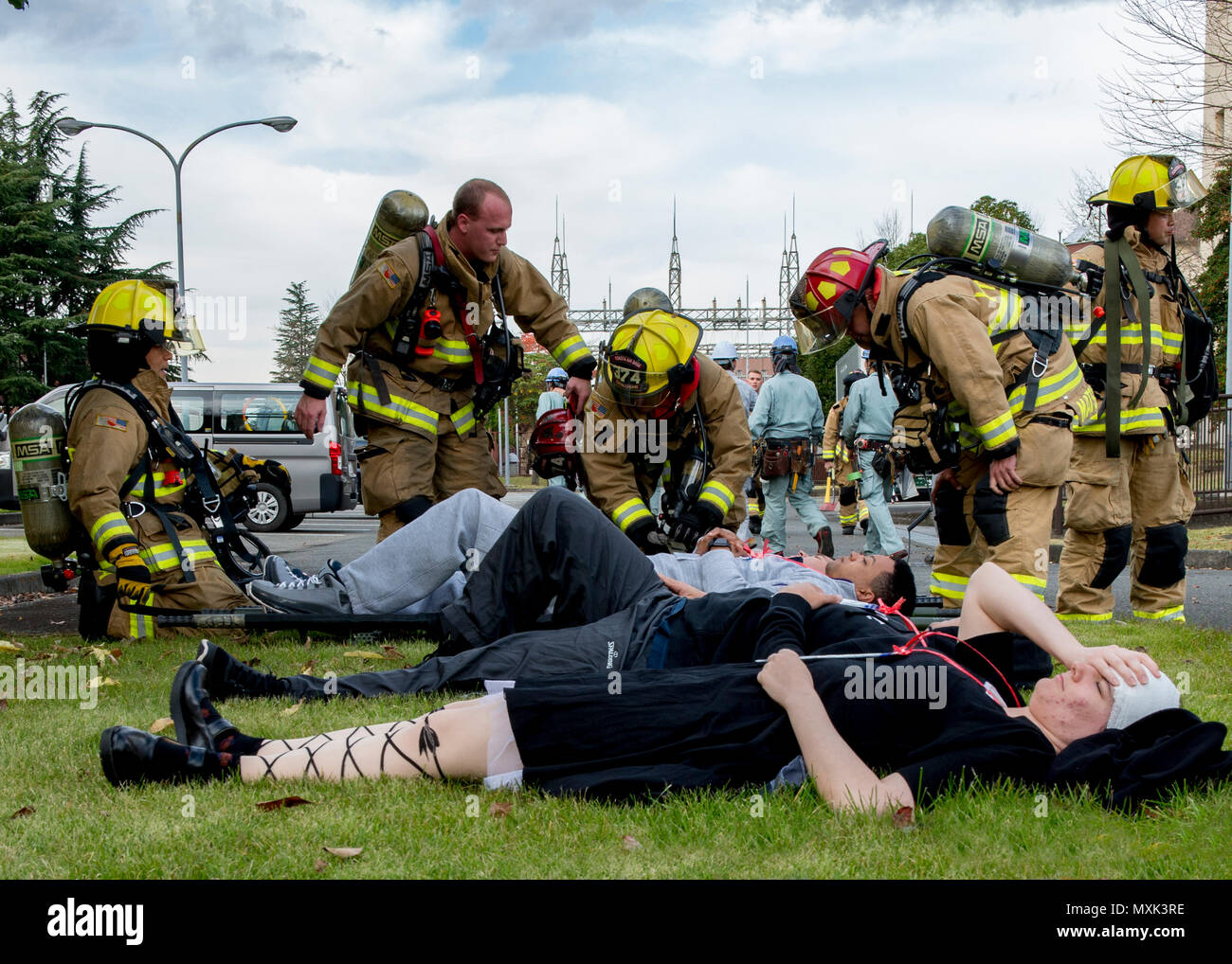 Firefighters from the 374th Civil Engineer Squadron practice first aid ...