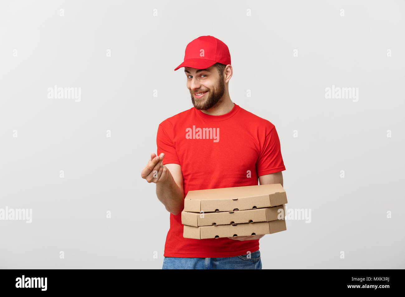 Delivery Concept: Handsome Pizza delivery man showing delicious ...