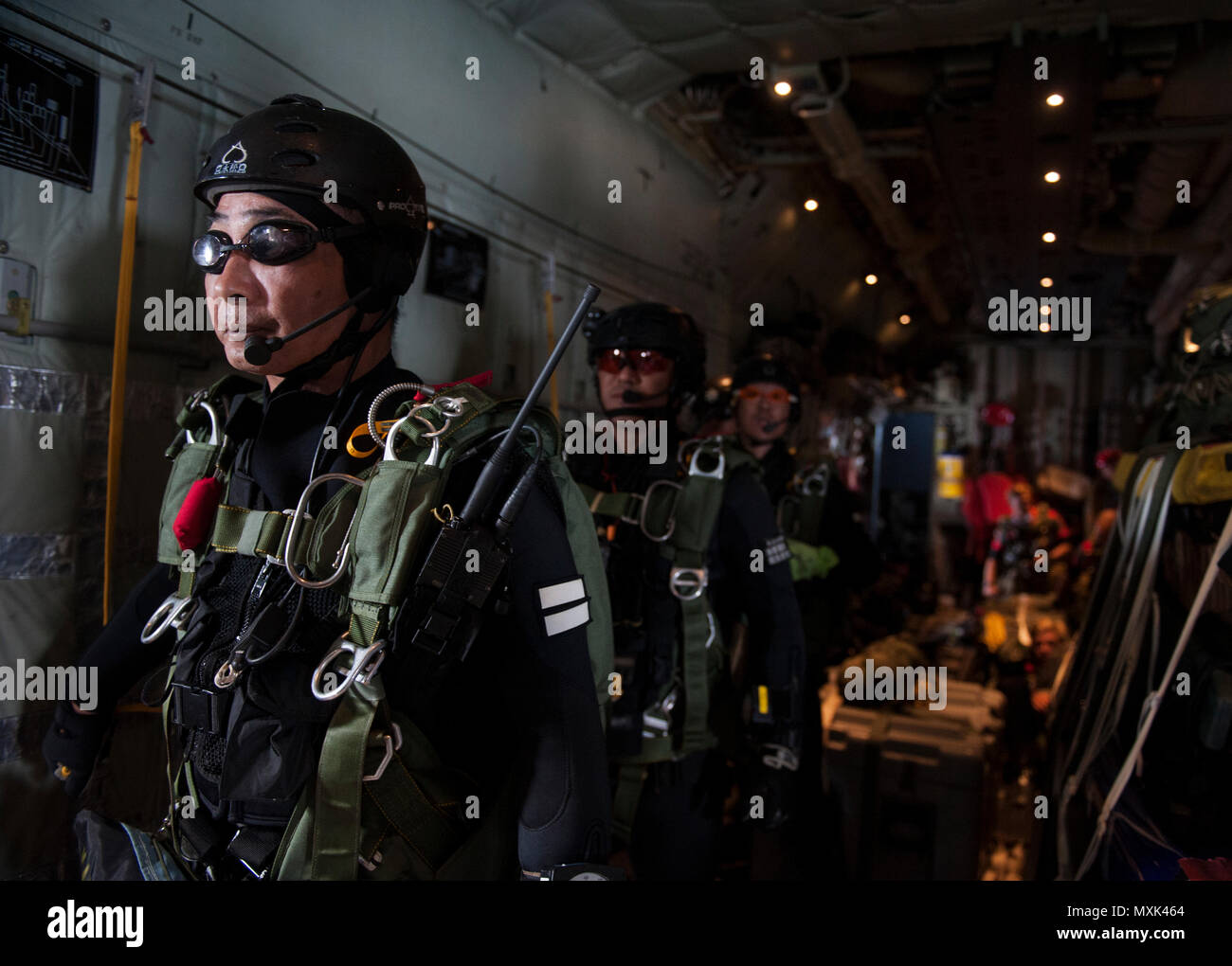 Japan Air Self-Defense Force pararescuemen prepare to jump out of an MC ...