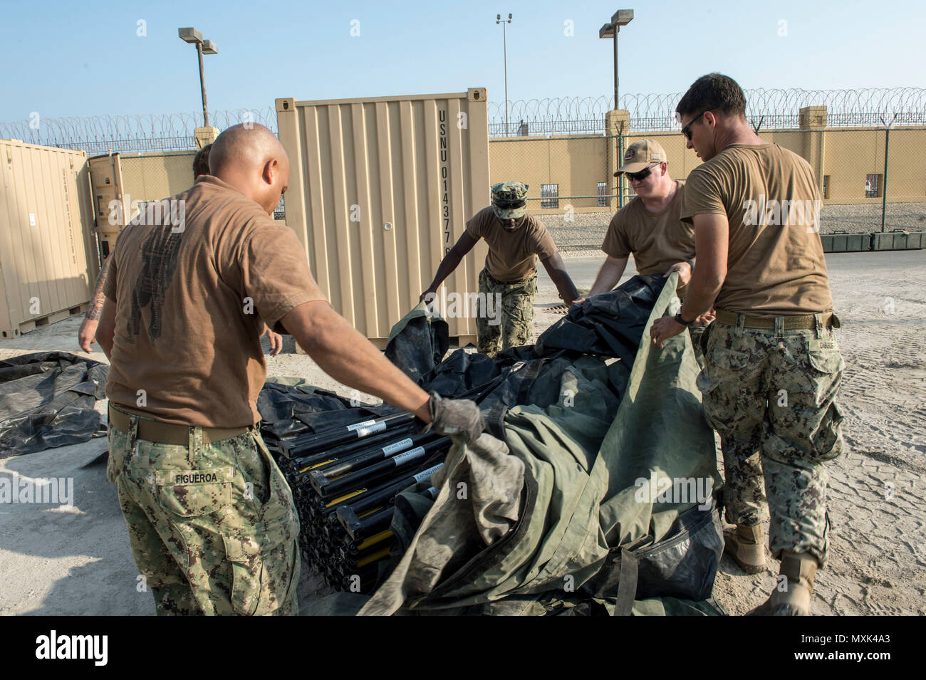 Sailors attached to Commander, Task Force (CTF) 56, sets up tents ...