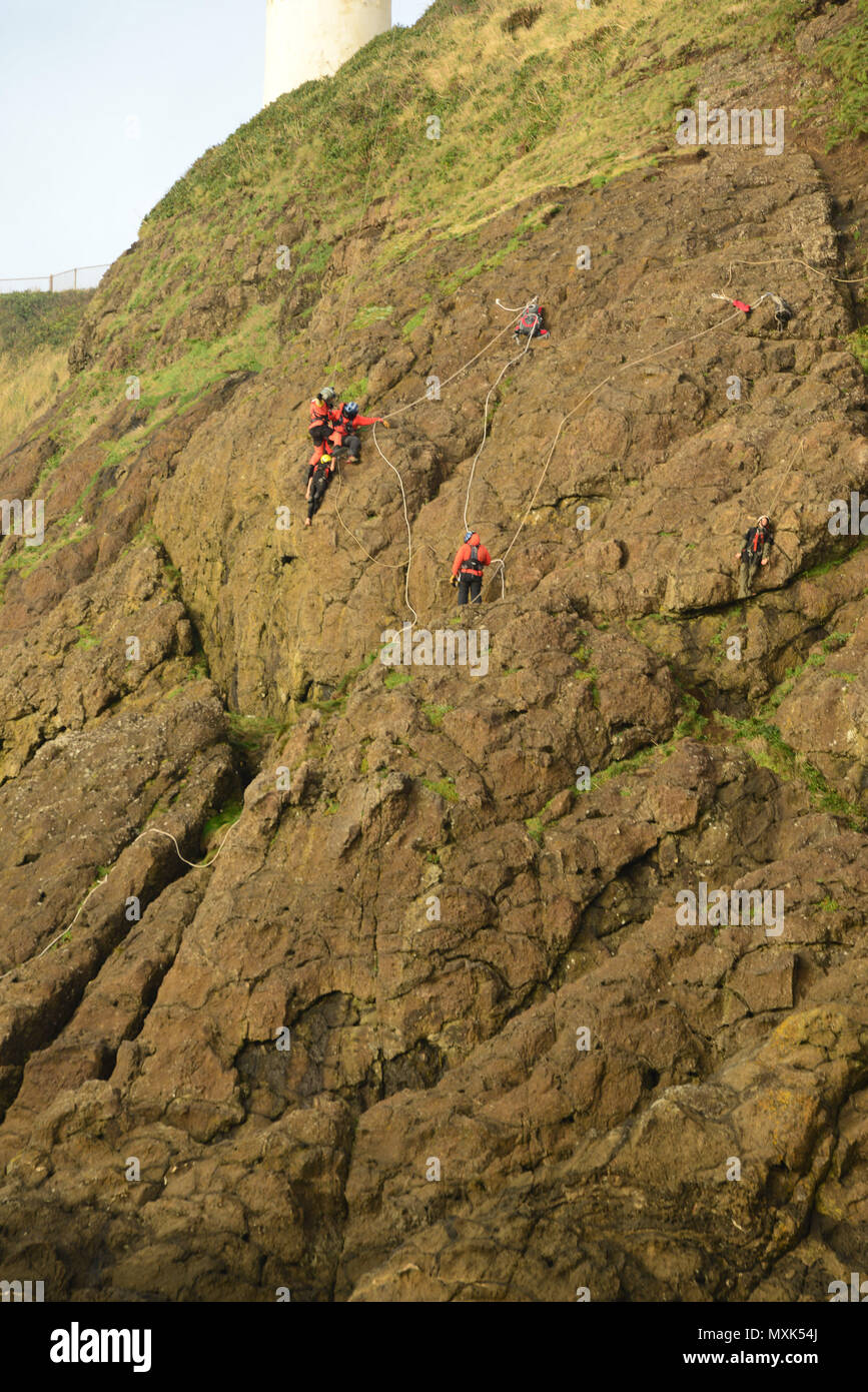 An aviation survival technician conducts cliff rescue training near the ...