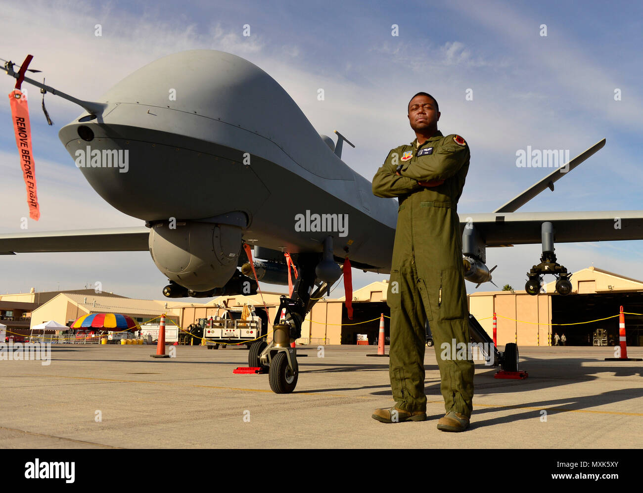 Staff Sgt. Kenneth, 432nd Wing MQ-9 sensor operator, stands in front of ...