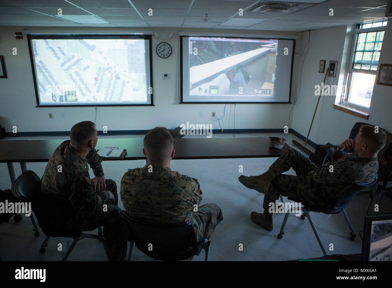 U.S. Marine Corps Lt. Col. Marcus J. Mainz, left, commanding officer ...