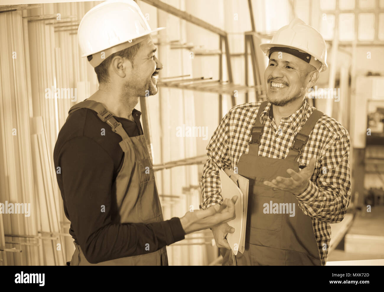 european mechanical engineer inspecting the work of labour at modern ...