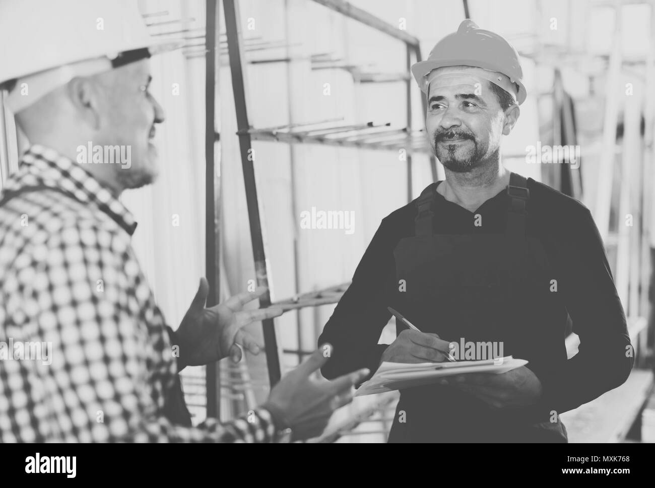 happy european mechanical engineer inspecting the work of labour at ...