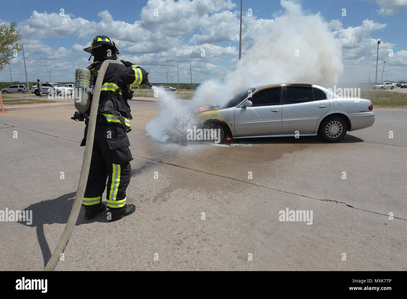 William Green, Tinker Fire and Emergency Services firefighter, sprays ...