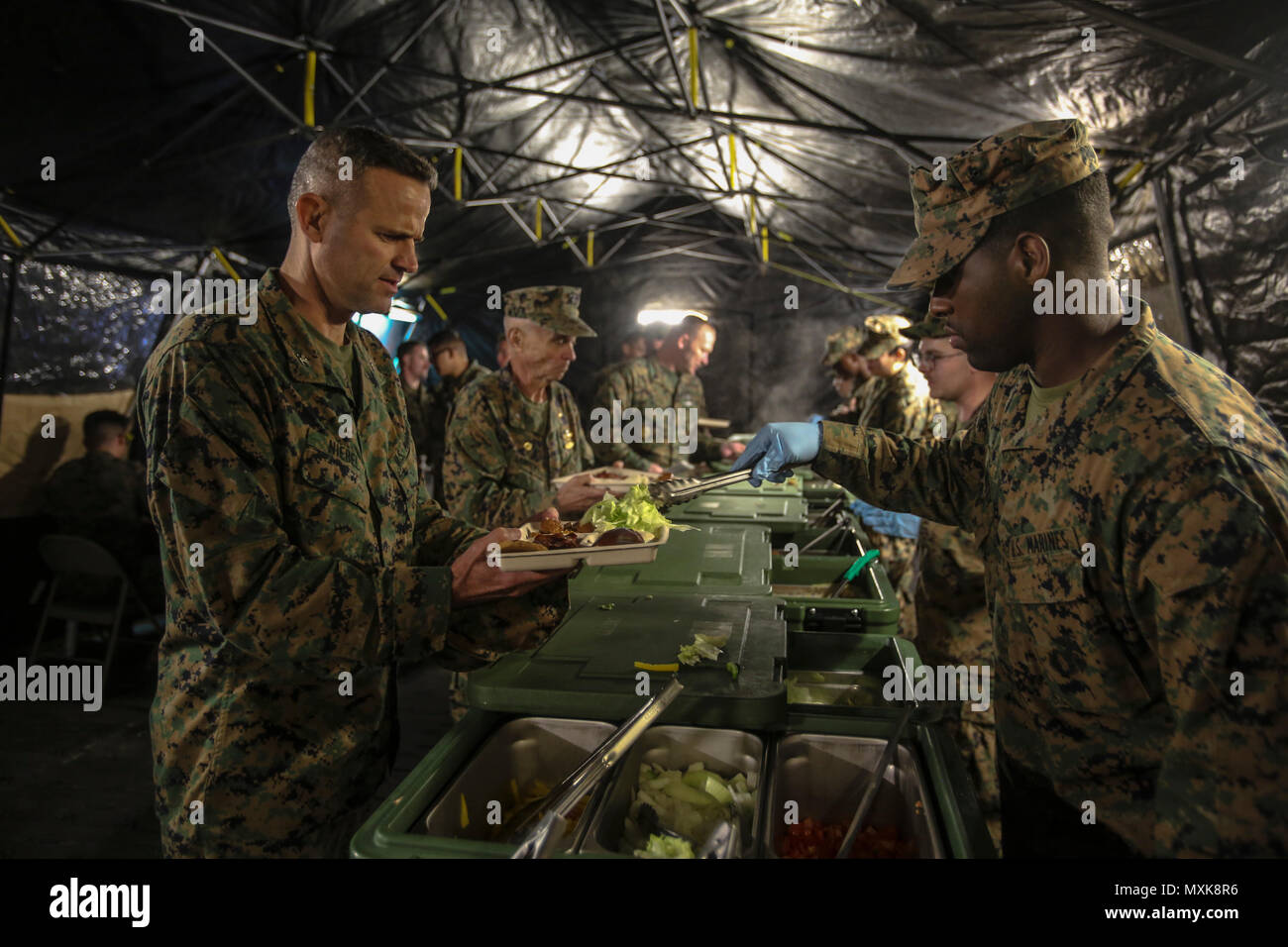 Corporal Logan Twitty serves Col. Andrew Niebel after the 2nd Marine ...
