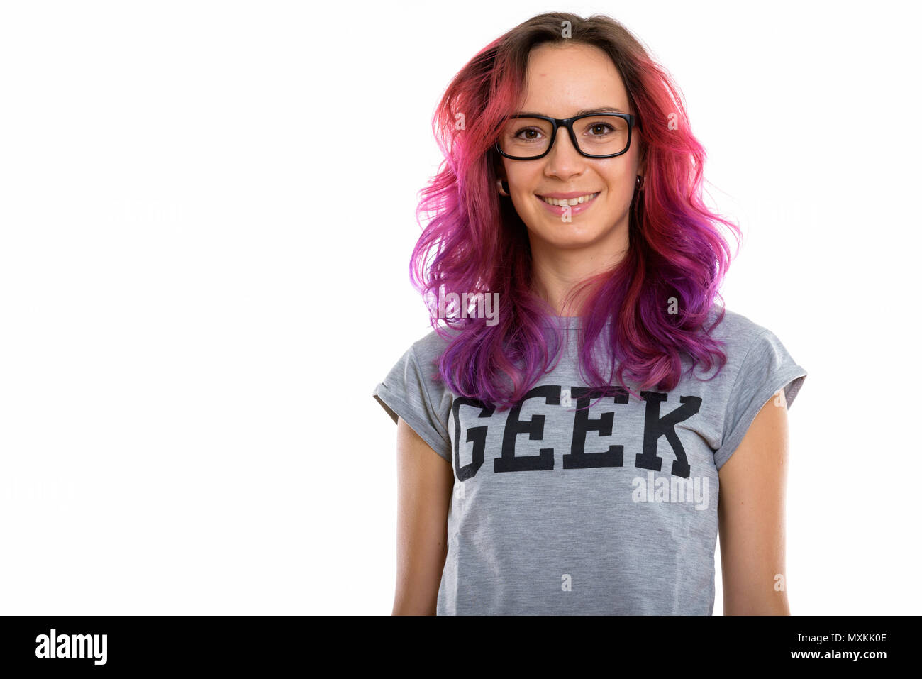 Studio shot of happy geek girl smiling while wearing eyeglasses Stock Photo - Alamy