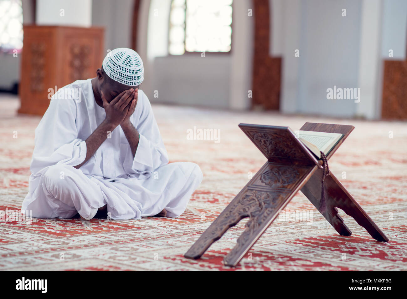 African Muslim Man Making Traditional Prayer To God While Wearing ...