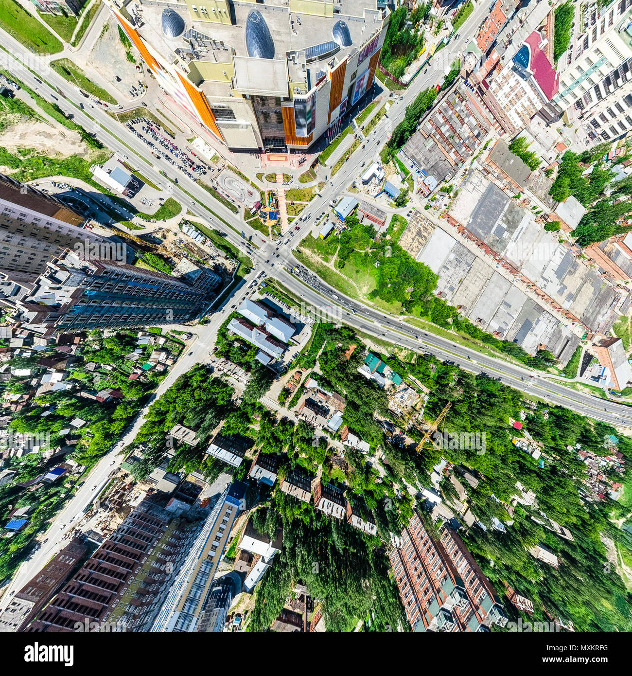 Aerial city view with crossroads and roads, houses, buildings, parks ...