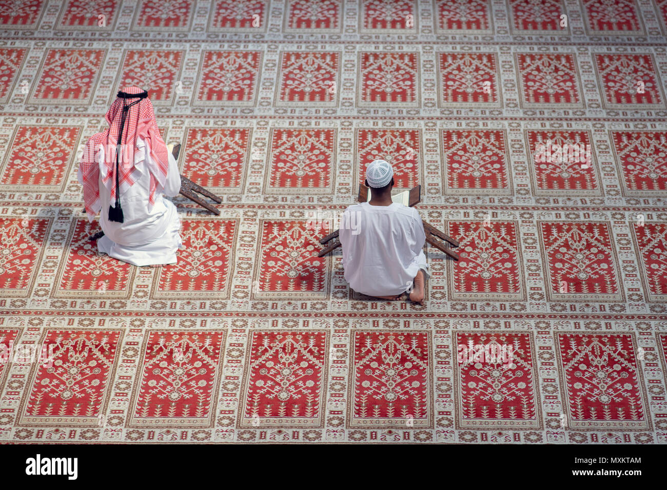 Two religious muslim man praying together inside the mosque Stock Photo ...