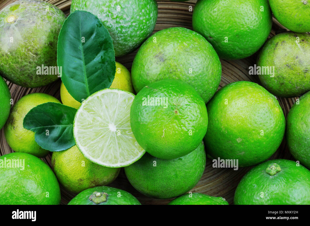 Fresh green lime cut of half with the background Stock Photo - Alamy