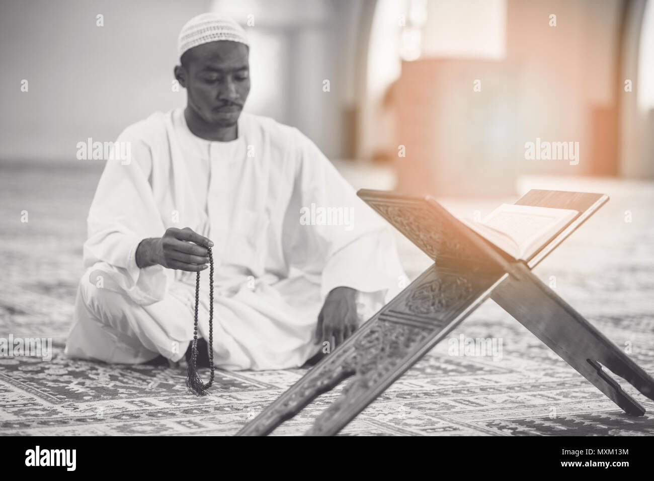 African Muslim Man Making Traditional Prayer To God While Wearing ...