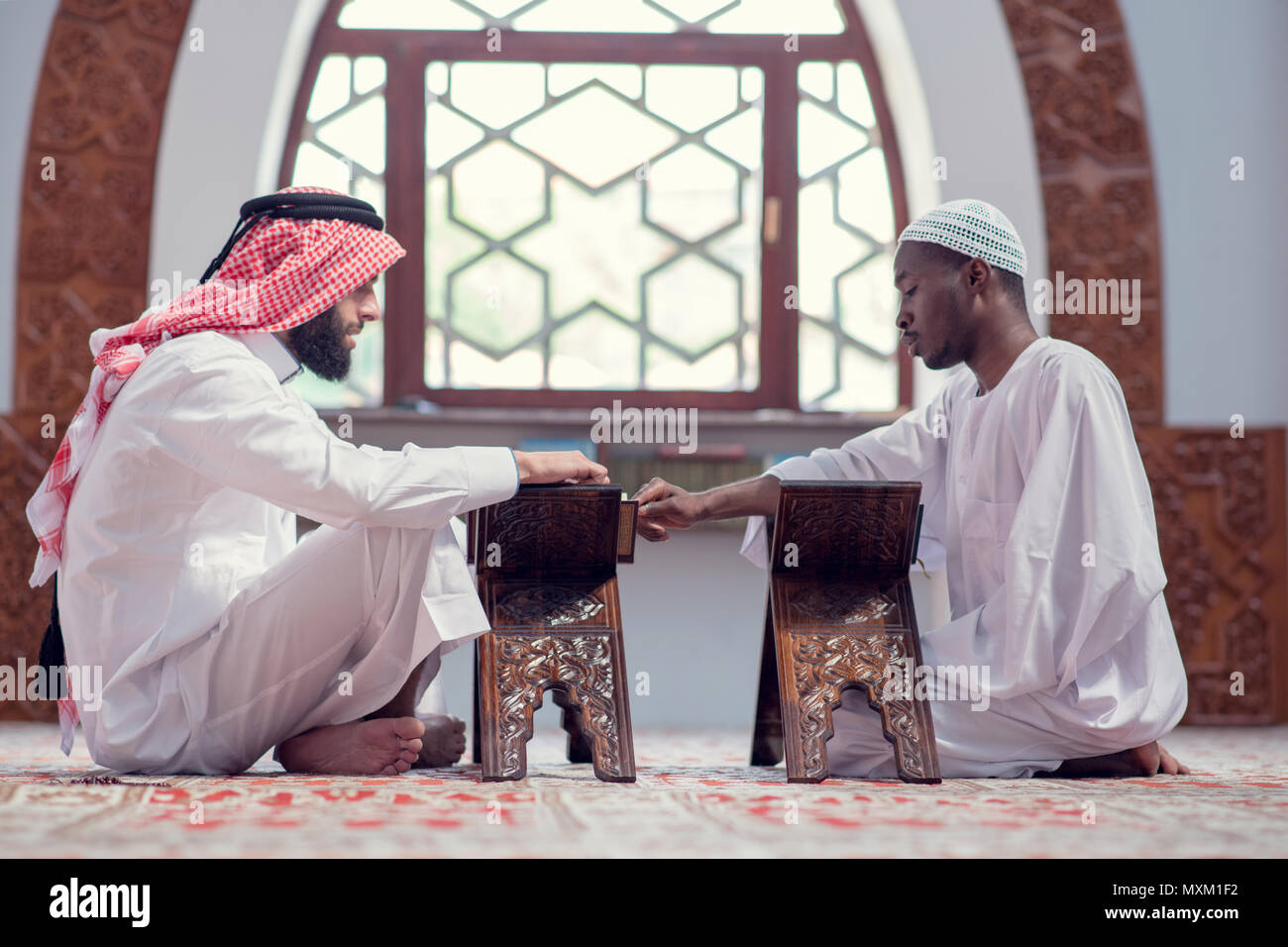 Old man reading koran in hi-res stock photography and images - Alamy