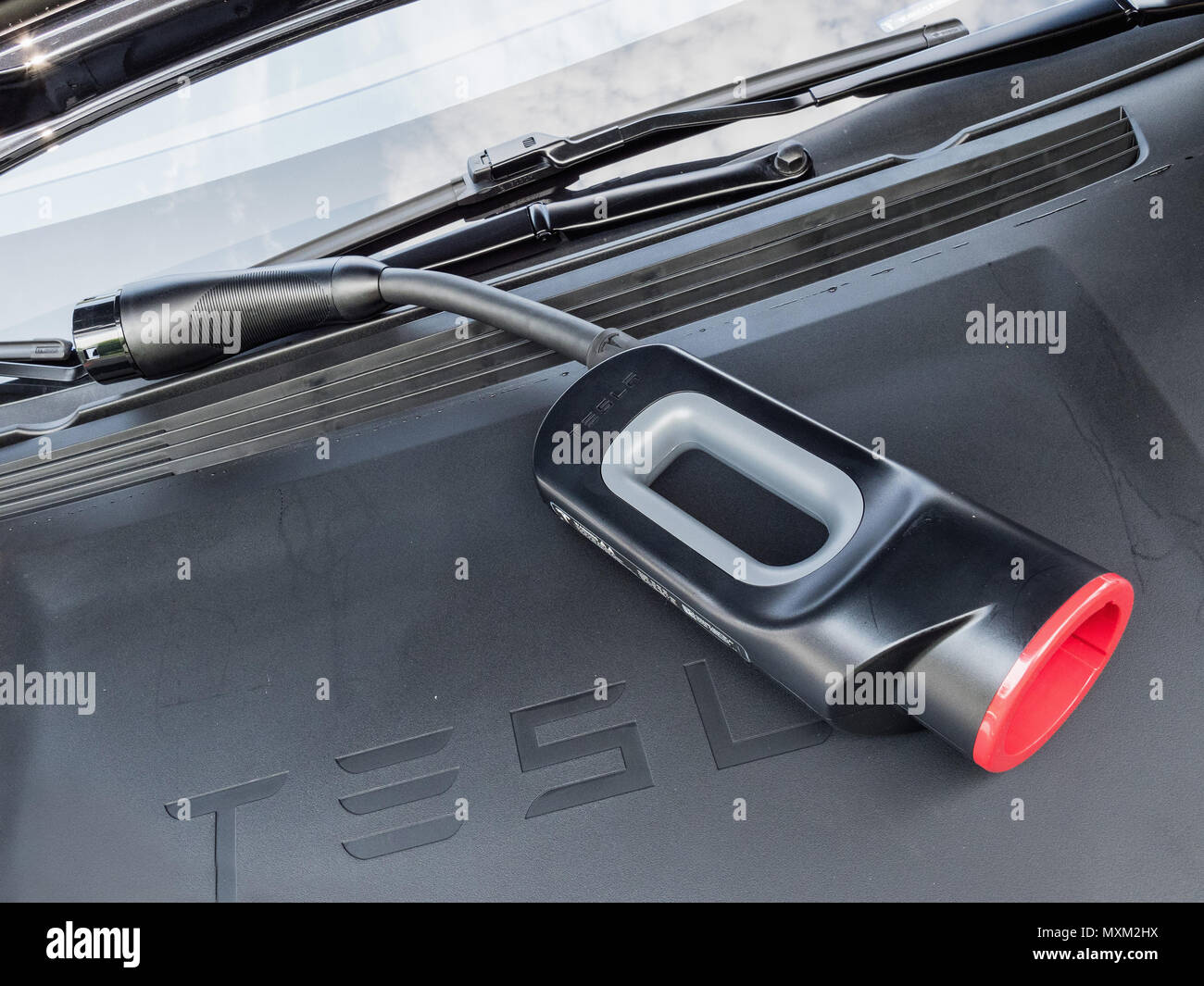 URMOND, NETHERLANDS - MAY 31, 2018. Charging cable for electric motor ...