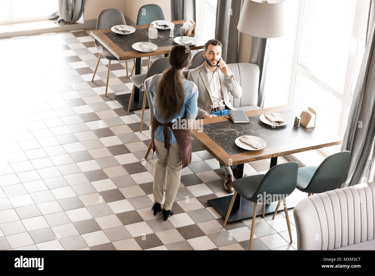Waiting for the guest hi-res stock photography and images - Alamy