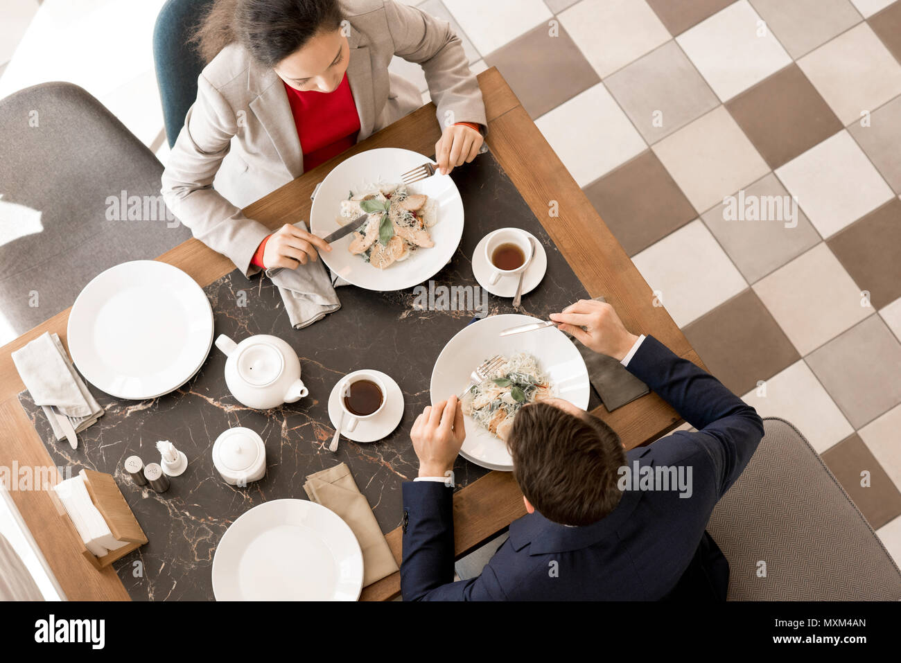 Business partners having dinner together in restaurant Stock Photo - Alamy