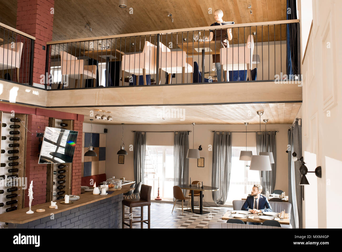 Modern comfortable restaurant with customer and waitress Stock Photo ...
