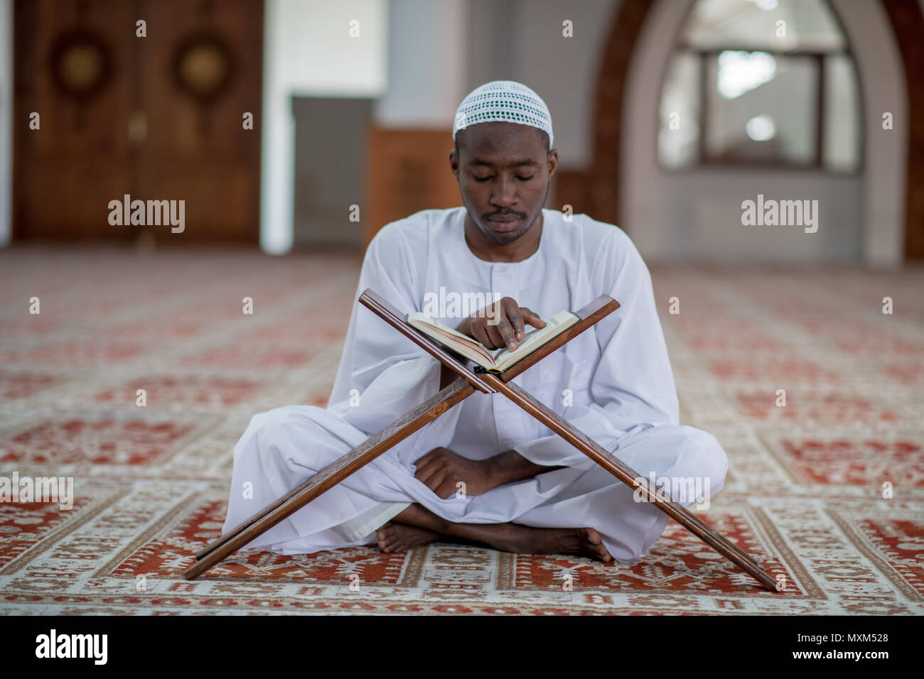 African Muslim Man Making Traditional Prayer To God While Wearing ...