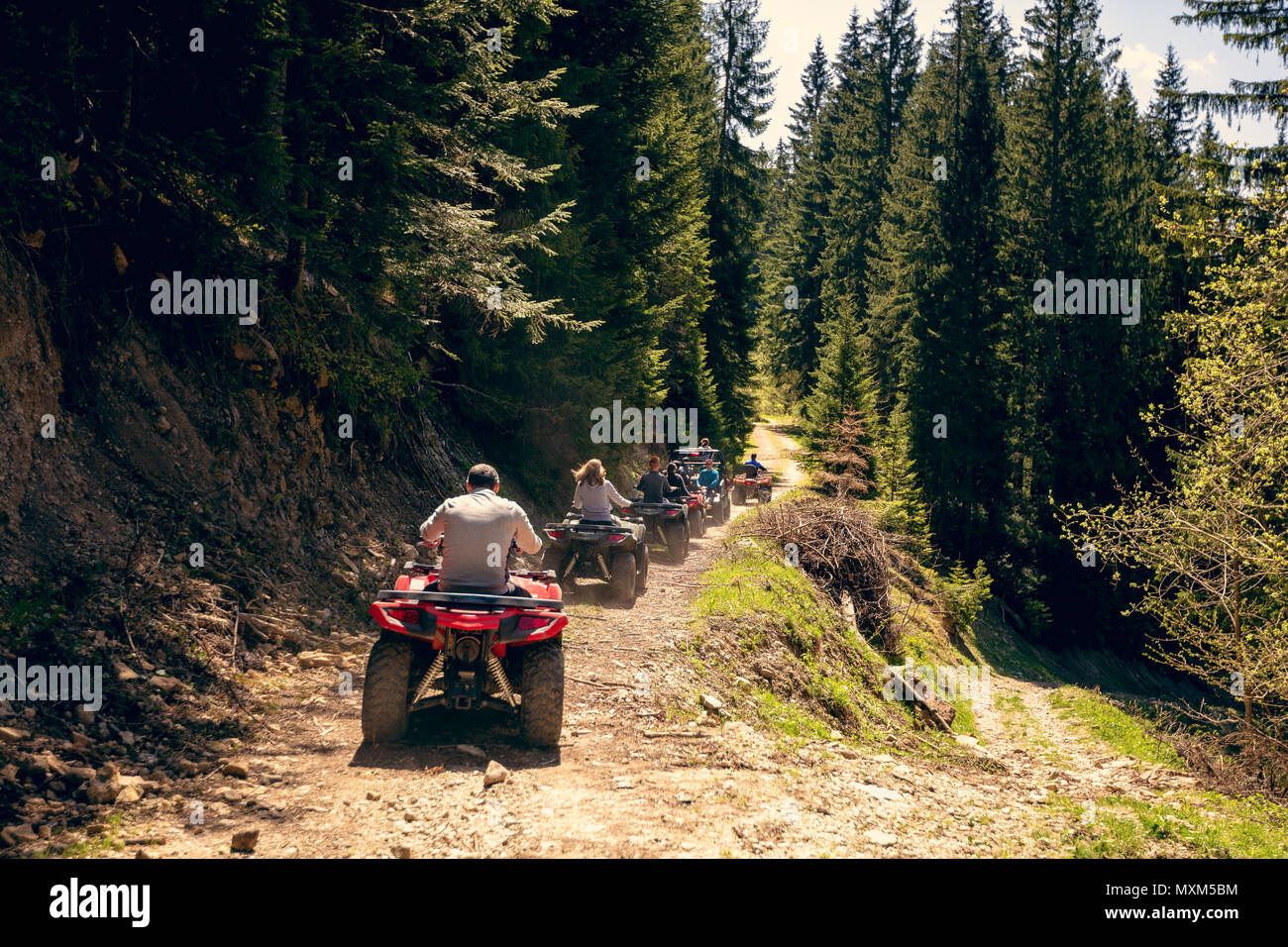 A tour group travels on ATVs and UTVs on the mountains Stock Photo - Alamy