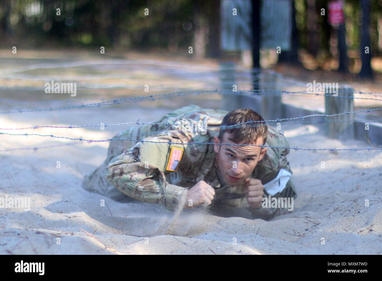 A 3rd Infantry Division Soldier navigates a wire obstacle during Marne ...