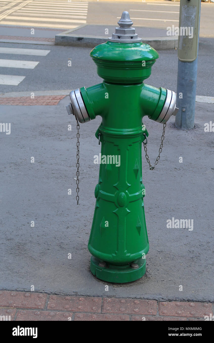 A green water hydrant Stock Photo - Alamy