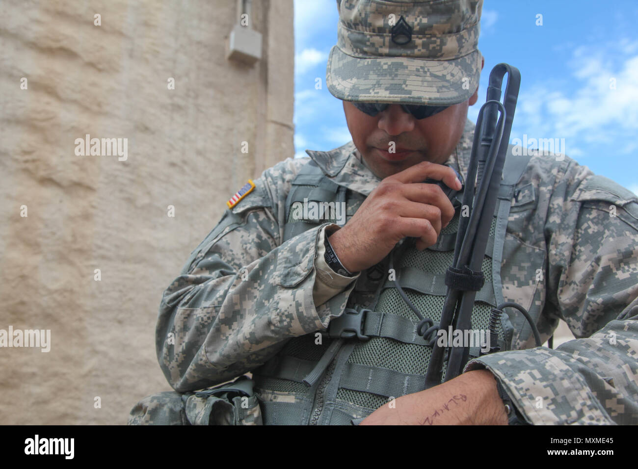 U.S. Army Staff Sgt. Jaime Avila calls in a request to proceed with ...