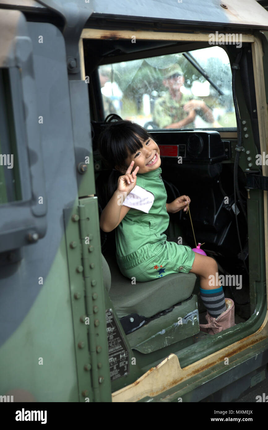 An Okinawa resident poses inside a Humvee Nov. 20, 2016 during the ...